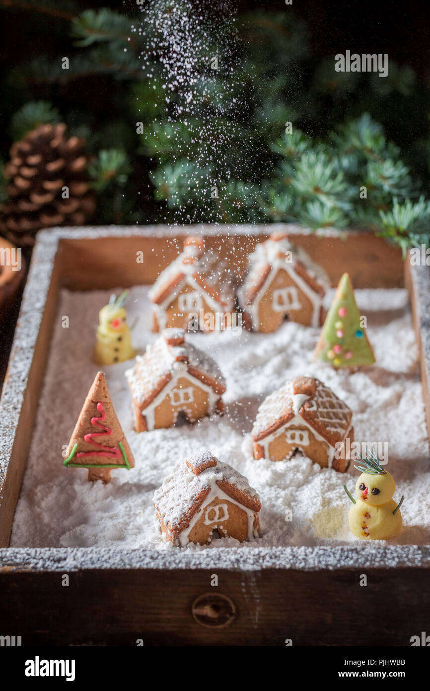 Falling snow on Christmas small gingerbread village Stock Photo - Alamy