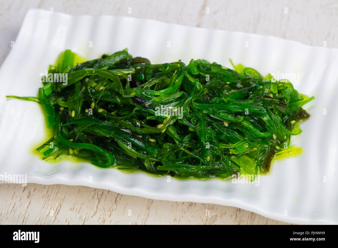 Tasty plate of marrinated algae Stock Photo - Alamy