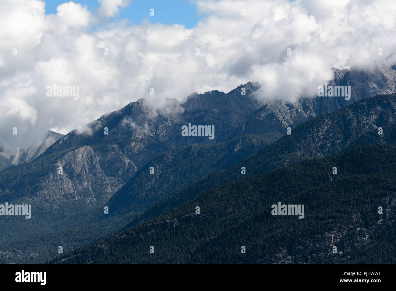 Morning mist rises above the Canadian Rockies Stock Photo - Alamy