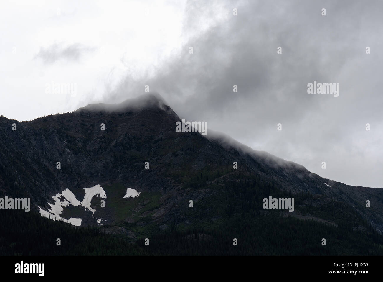 Mist rising in mountains after storm Stock Photo - Alamy