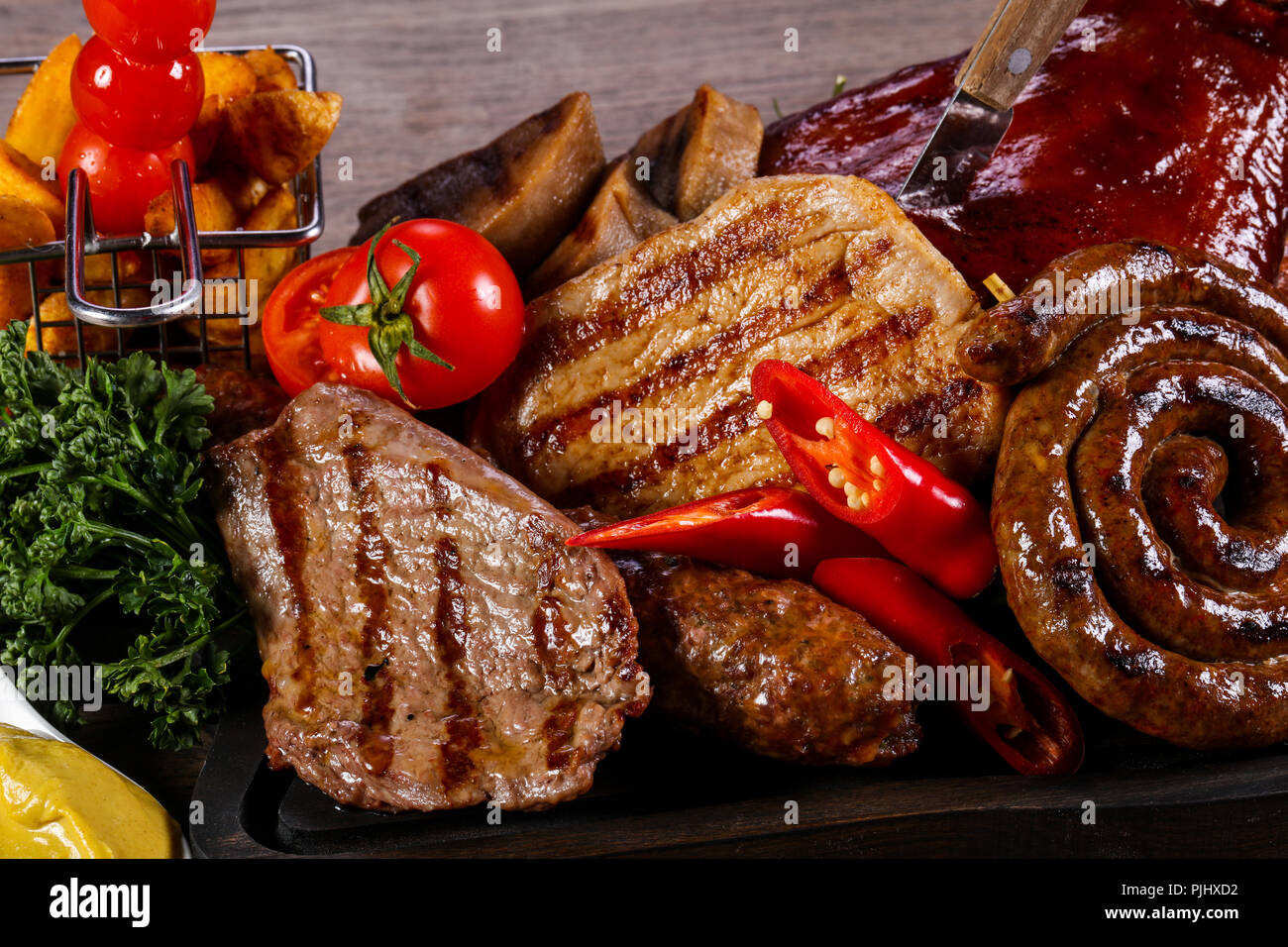 Grilled meat mix plate - beef, pork and chicken Stock Photo - Alamy