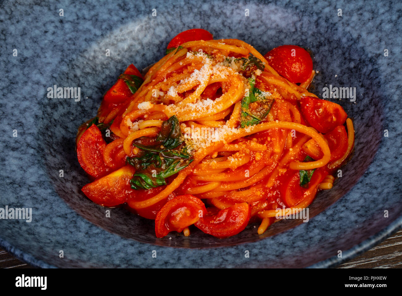 Red spaghetti with tomato,salt and basil Stock Photo - Alamy