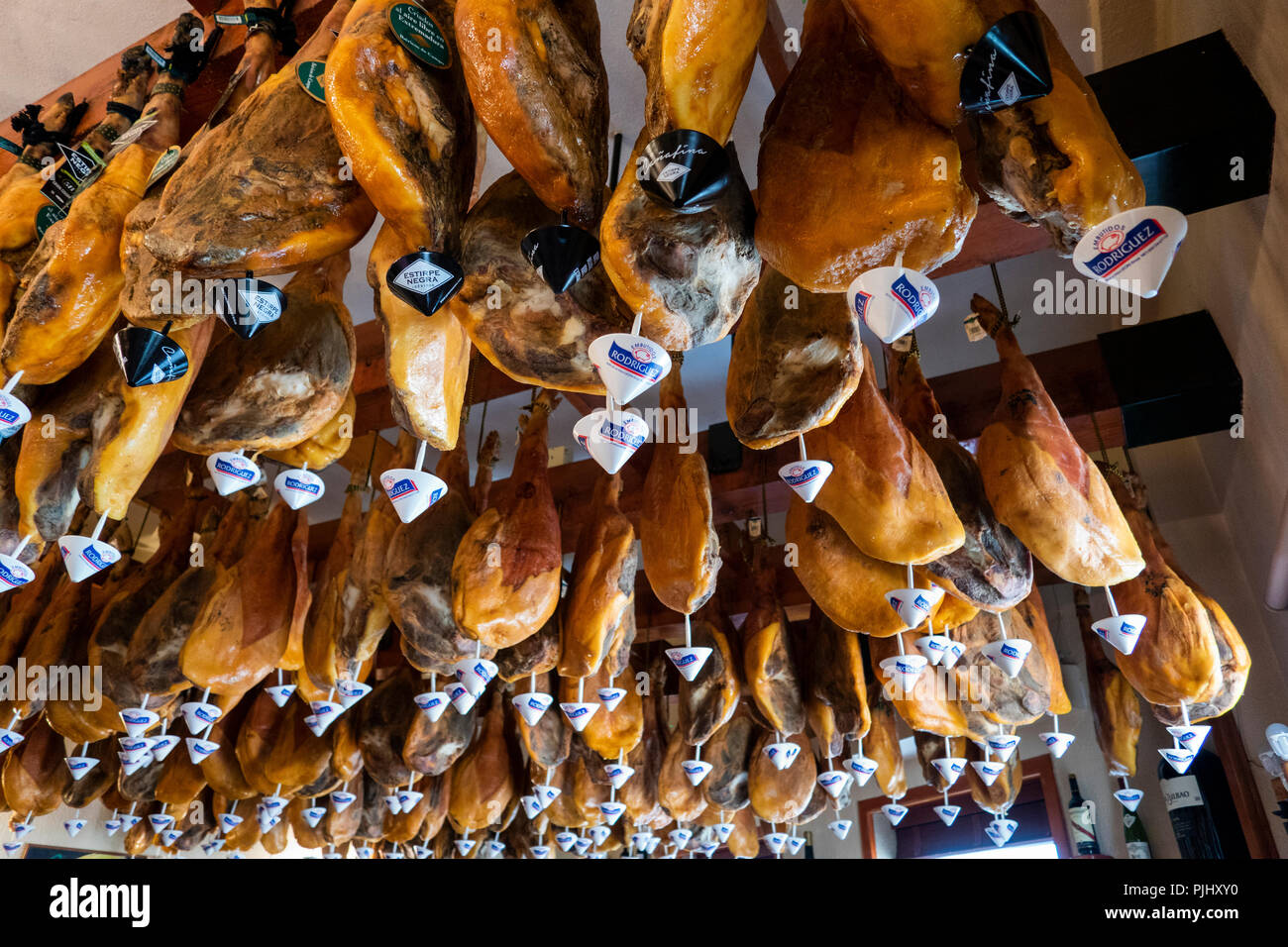 Hams hanging from ceiling hi-res stock photography and images - Alamy