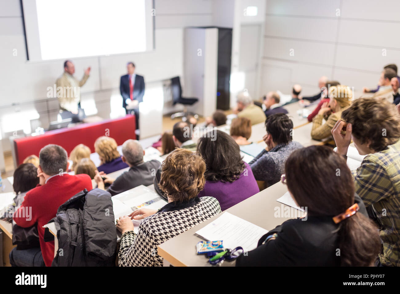 Business speaker giving a talk at business conference event Stock Photo ...