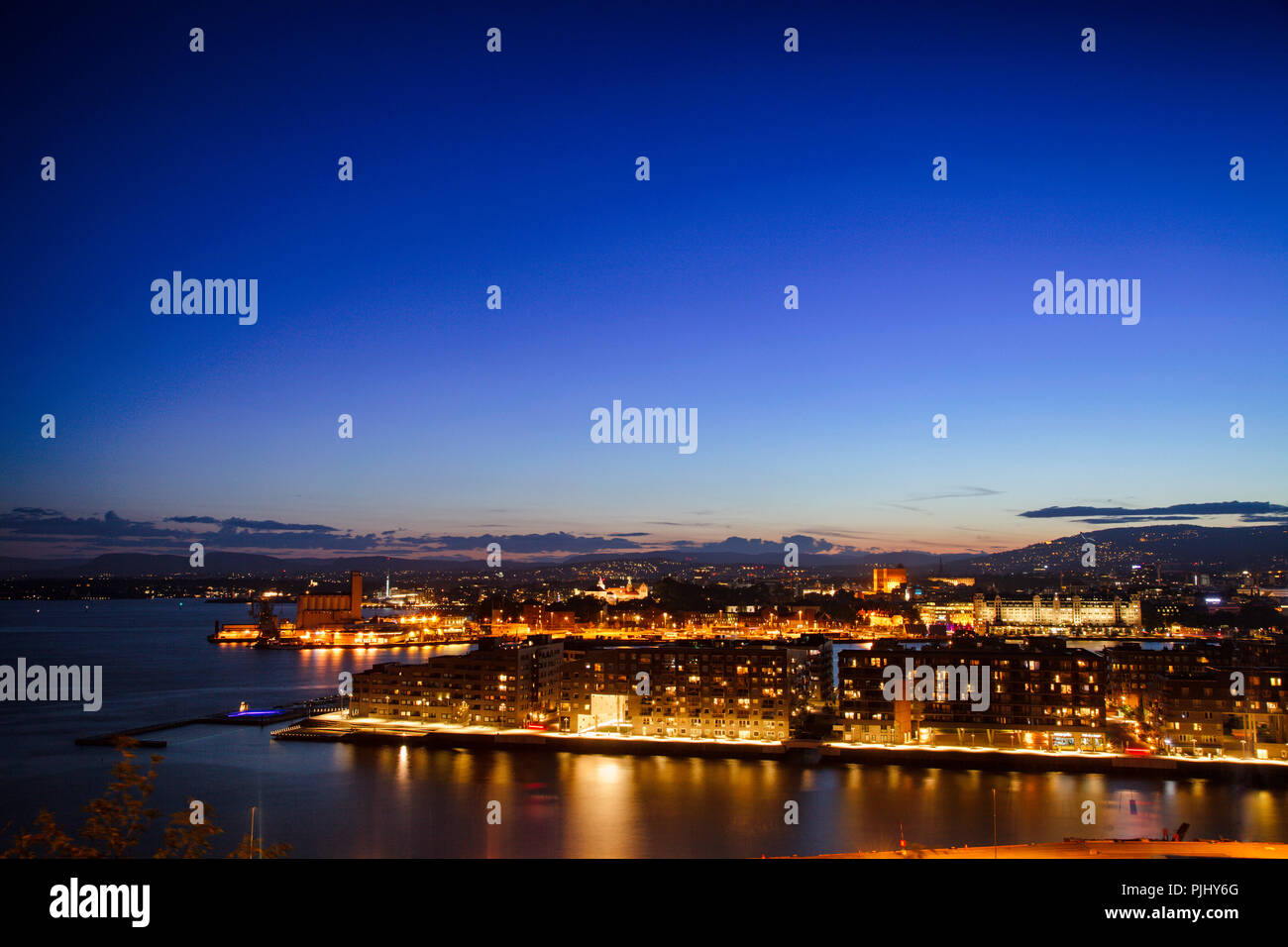 Oslo night cityscape as viewed from the Ekeberg hill, Norway ...