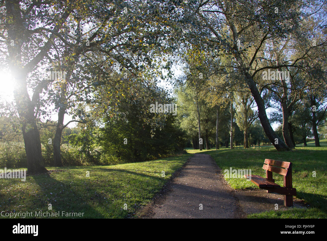 Sunrise Park Bench Stock Photo - Alamy