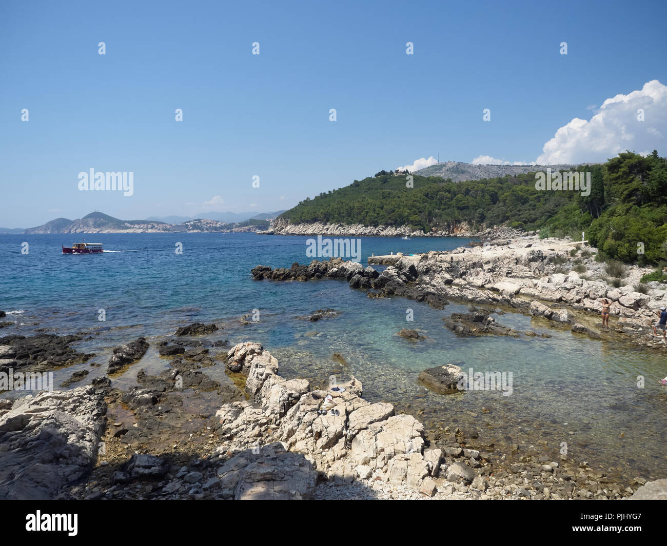 View of a beautiful rock beach in Lokrum island in a sunny summer day ...