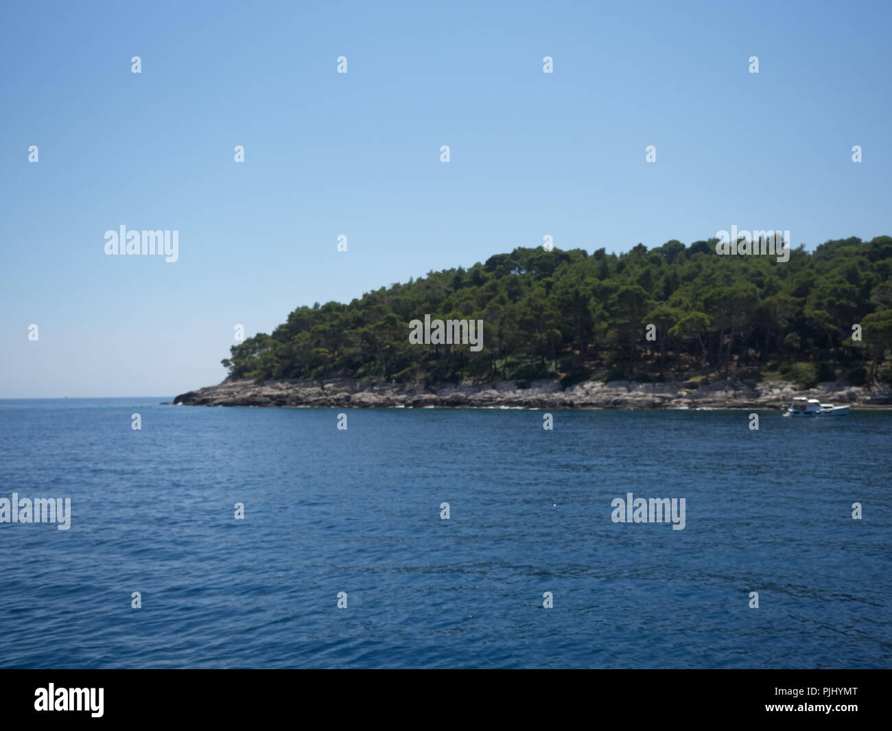 View of Lokrum island froam a boat tour in a sunny summer day ...