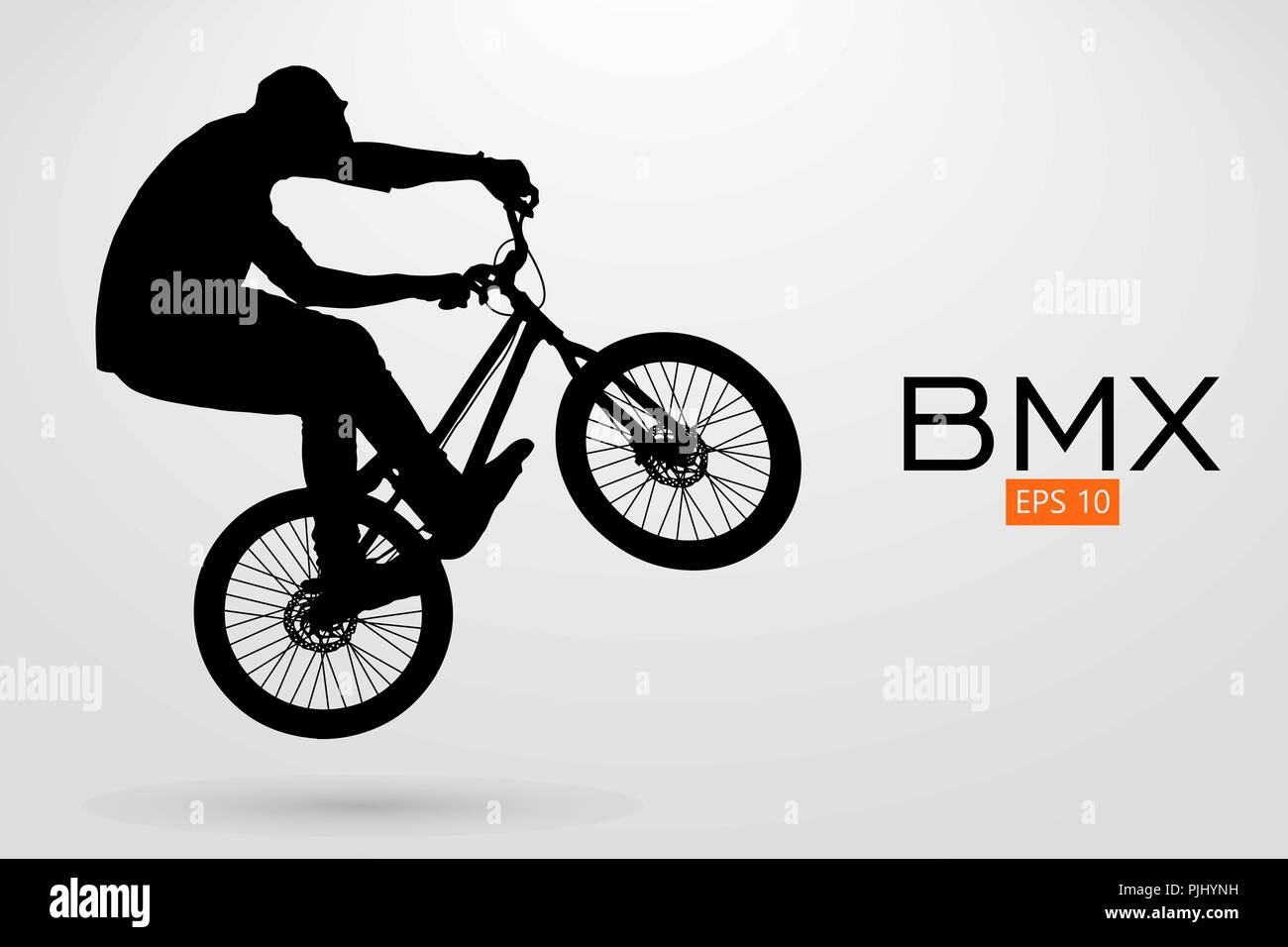 Silhouette of a BMX rider. Background and text on a separate layer ...