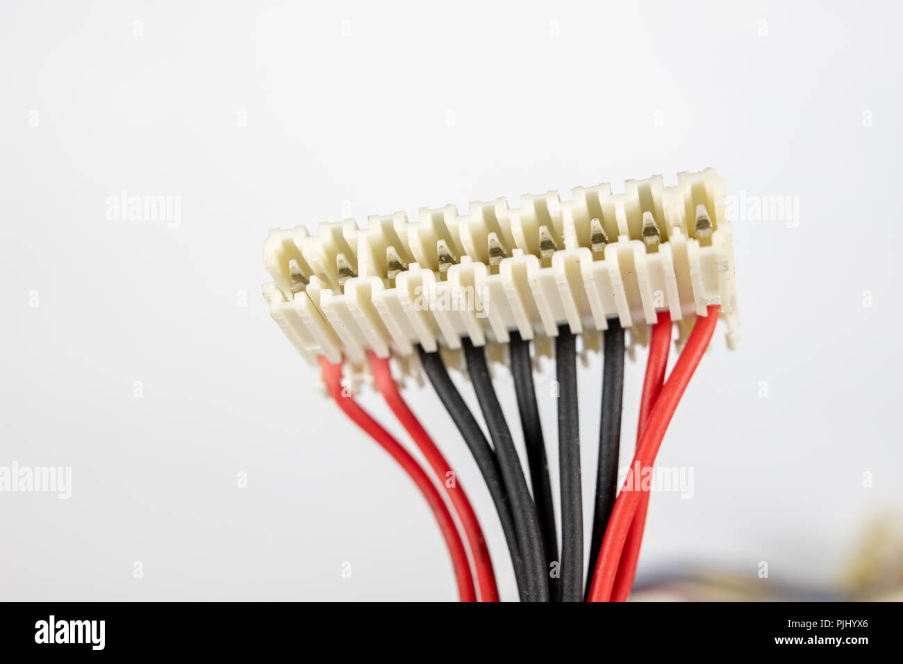 Old cables for electrical devices on a white table. Electrical ...