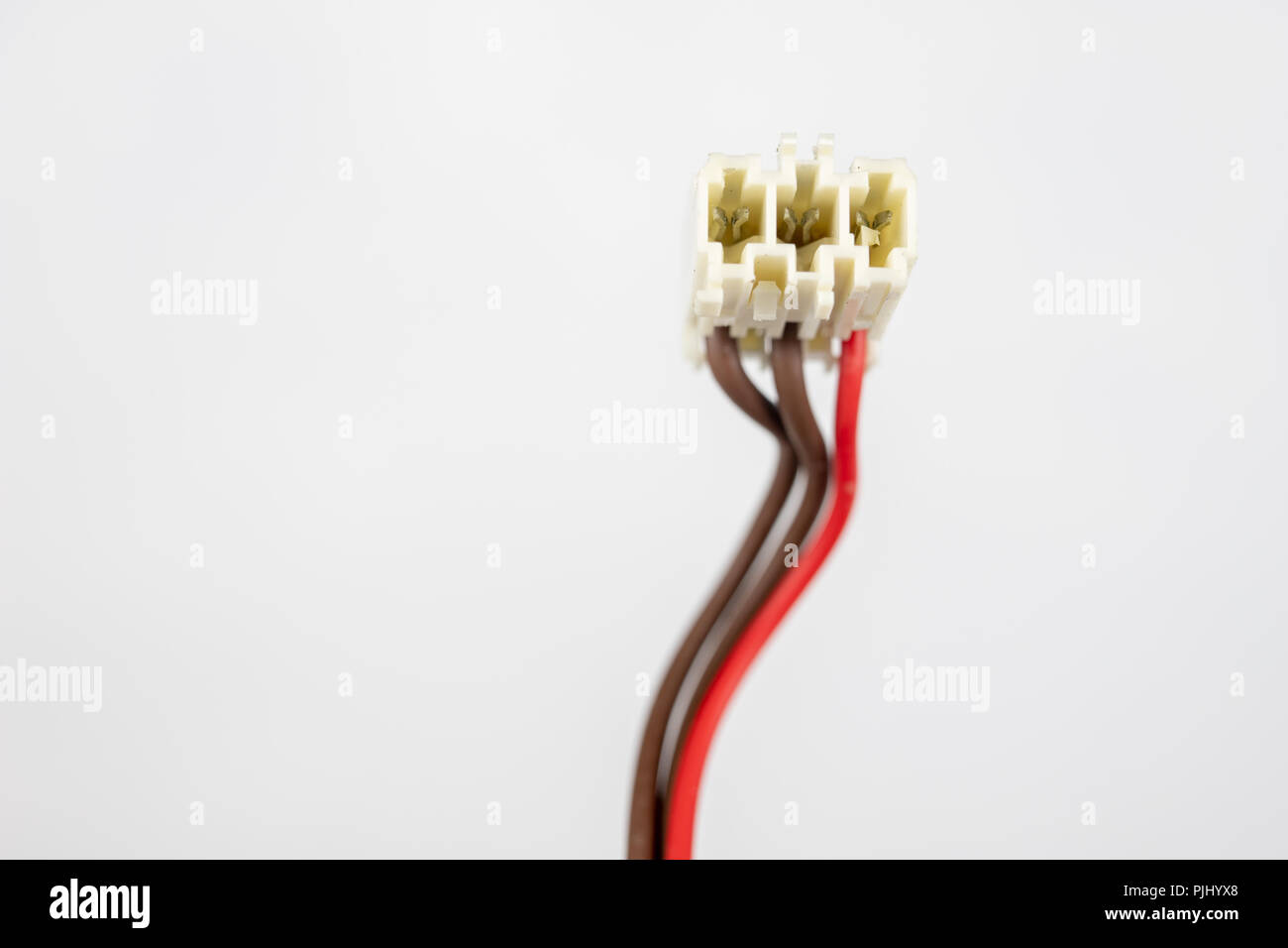 Old cables for electrical devices on a white table. Electrical ...