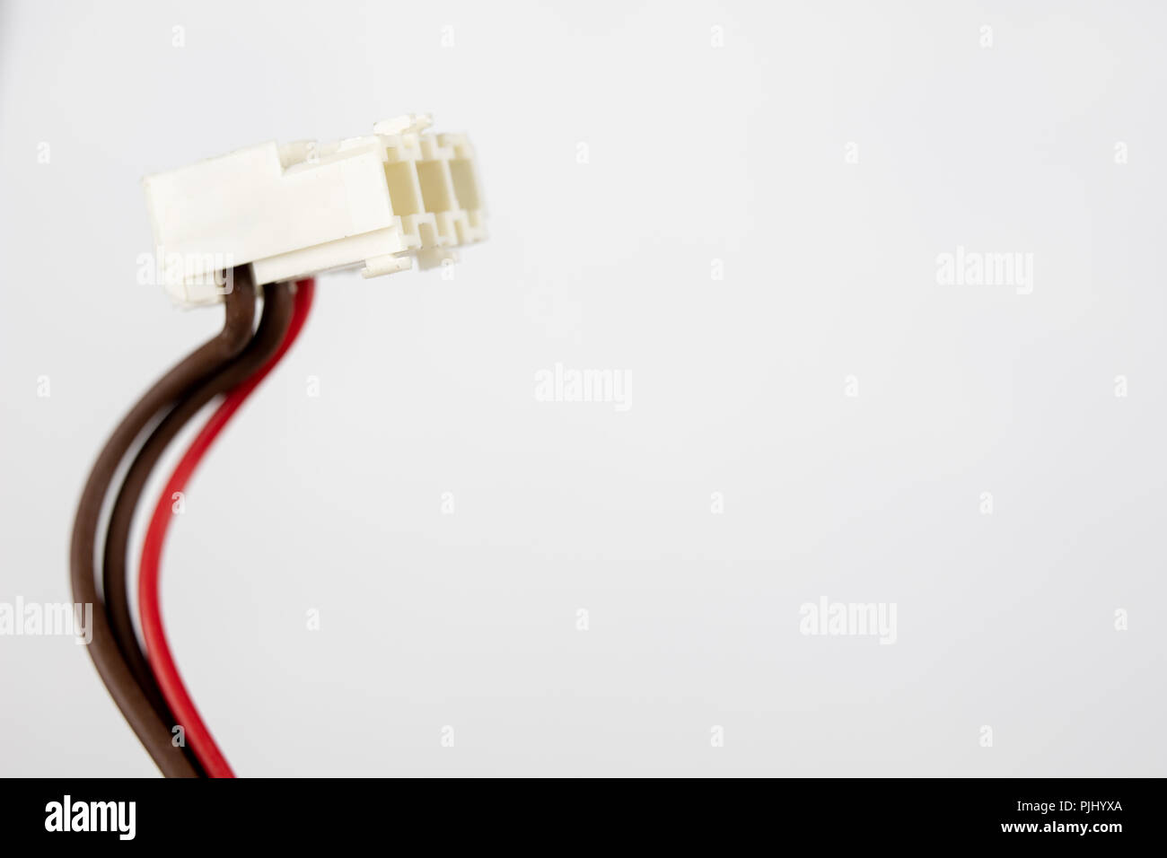 Old cables for electrical devices on a white table. Electrical ...