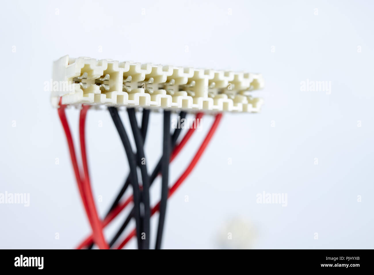 Old cables for electrical devices on a white table. Electrical ...