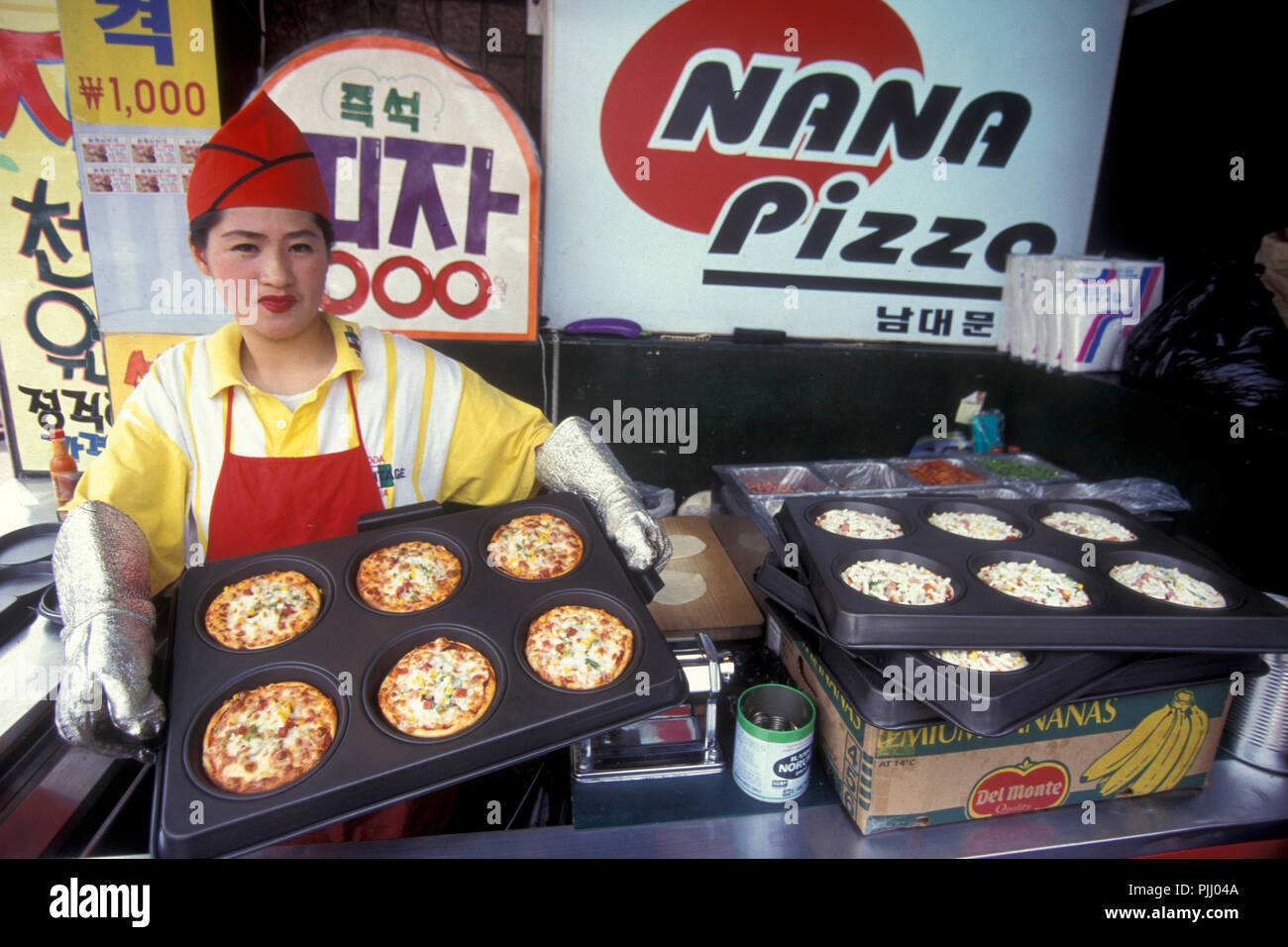people at a streetfood restaurant in city centre of Seoul in South ...