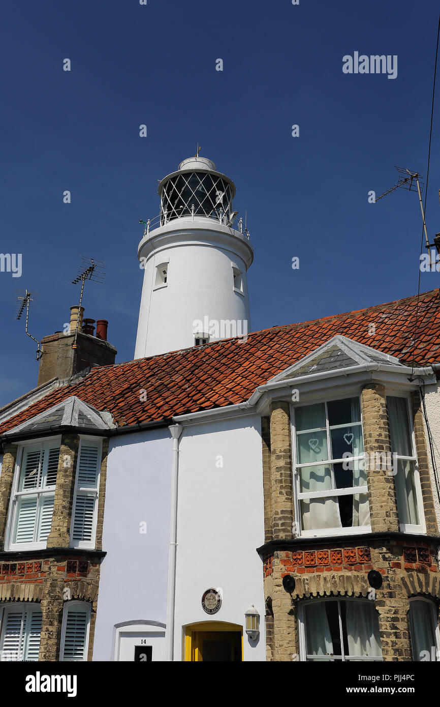 The Trinity House Lighthouse towers above local houses at Southwold ...
