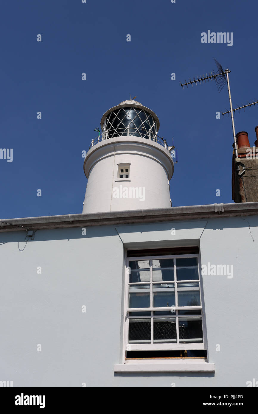 The Trinity House Lighthouse towers above local houses at Southwold ...