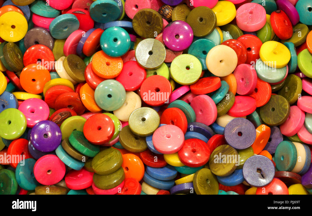 background of colored ivory buttons in a haberdashery Stock Photo - Alamy