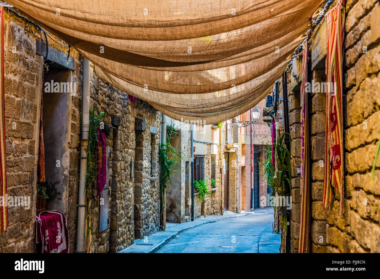 To protect themselves from the strong solar rays in the medieval city ...