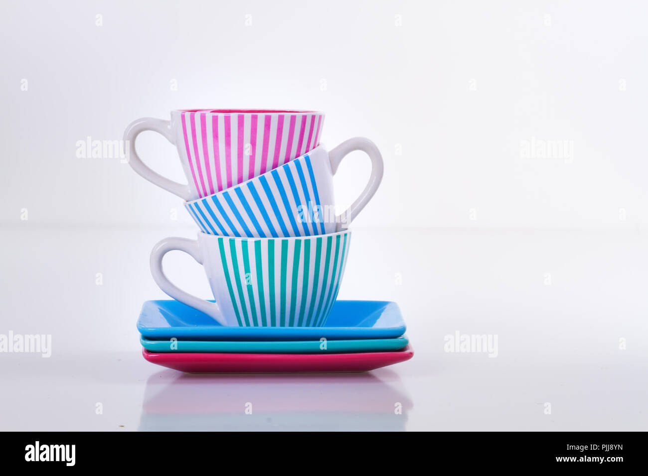 three color cups one in one Stock Photo - Alamy