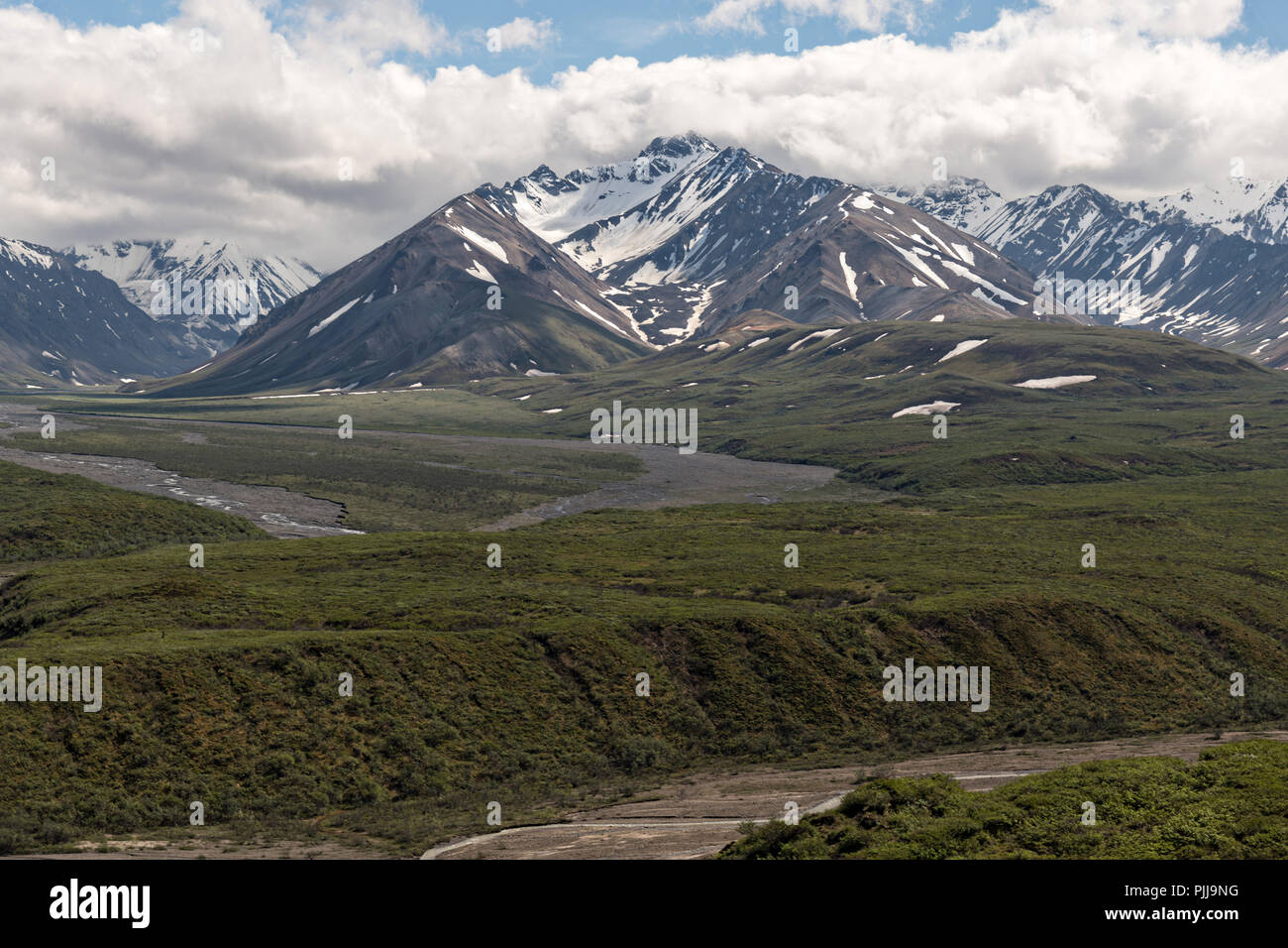 View of the East Fork river across the tundra with the Alaska Mountains ...