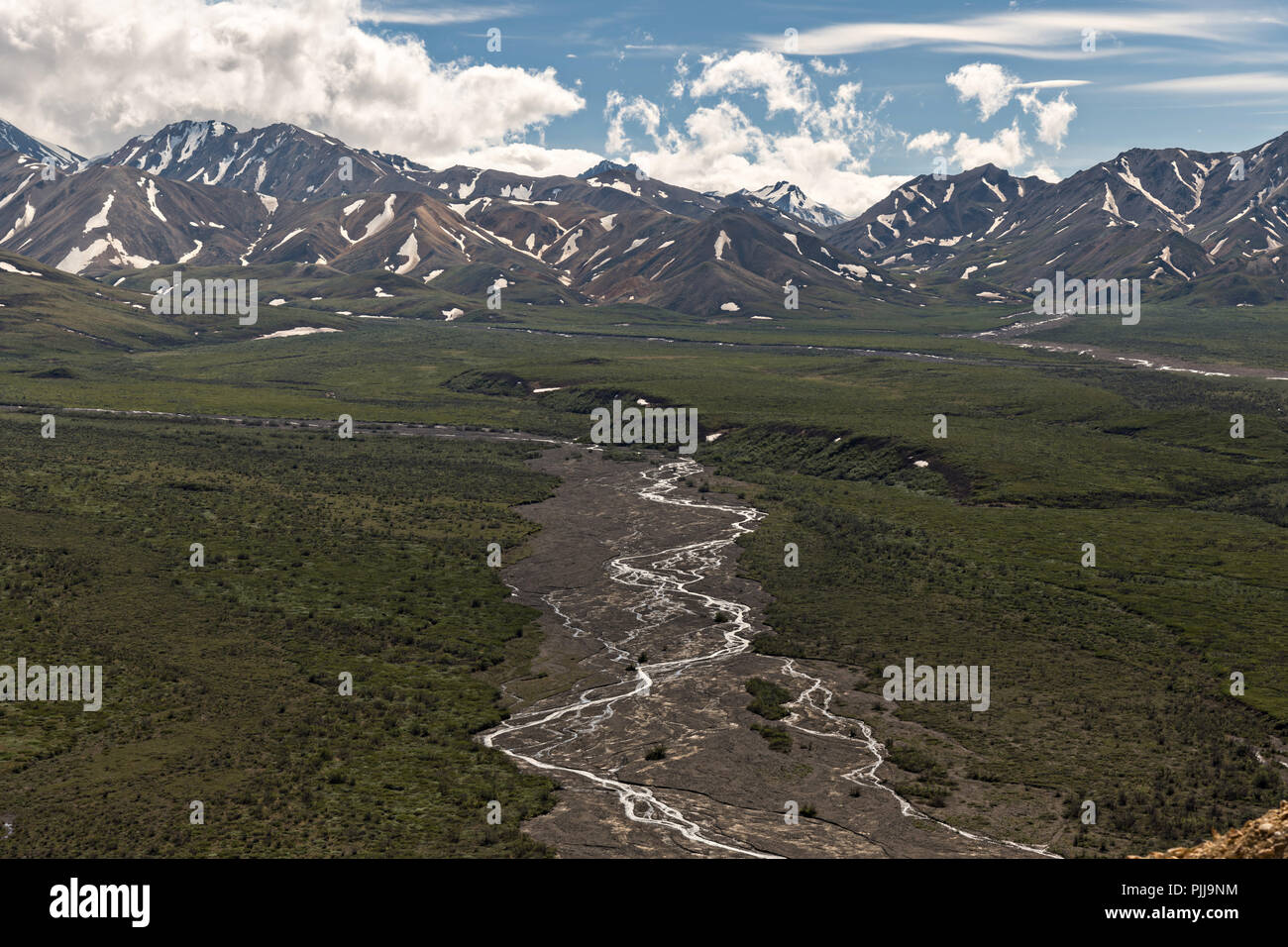 The braided Toklat River flows from the Polychrome Hills and the Alaska ...