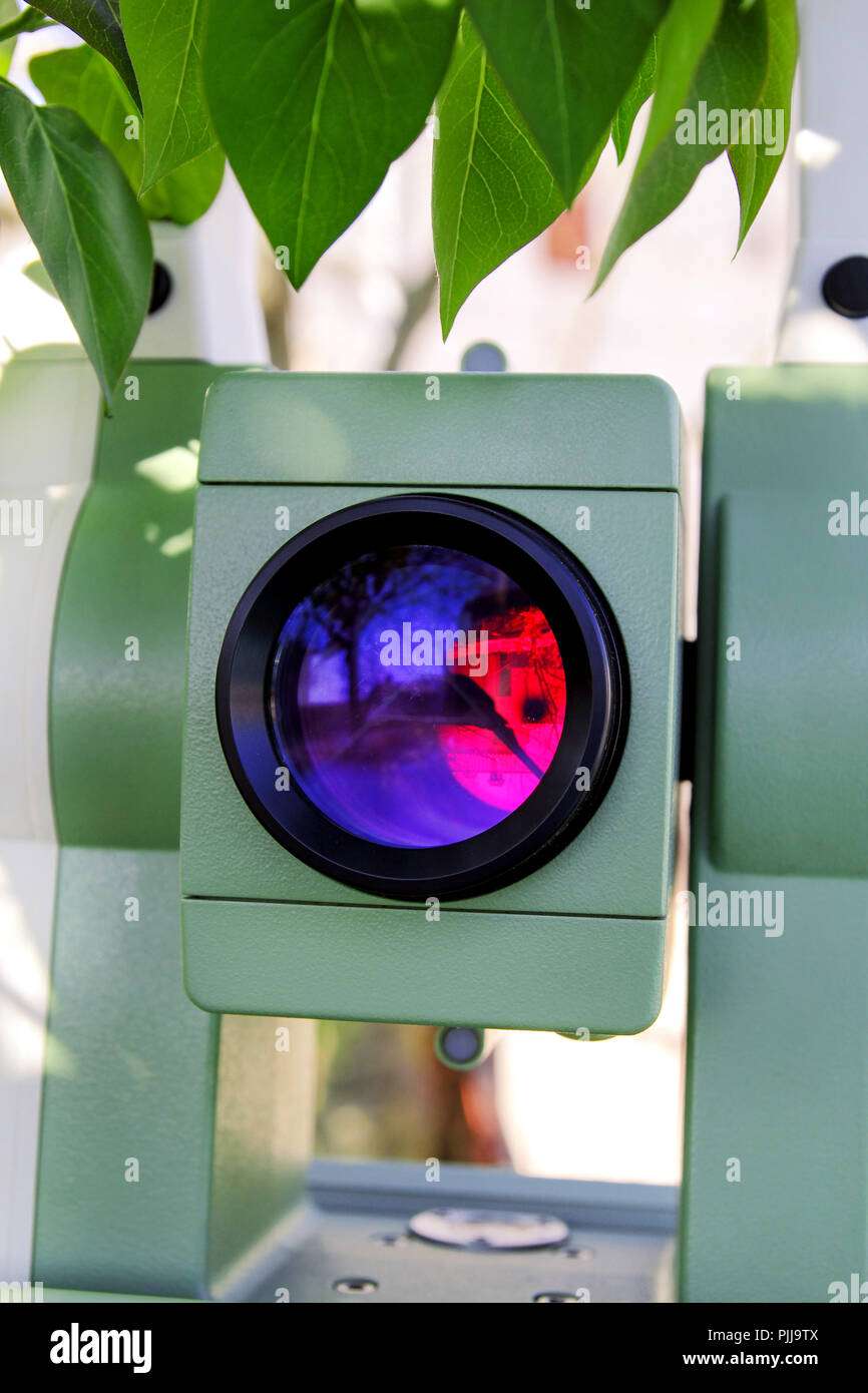 Part of total station instruments objective laser light is emitted from ...