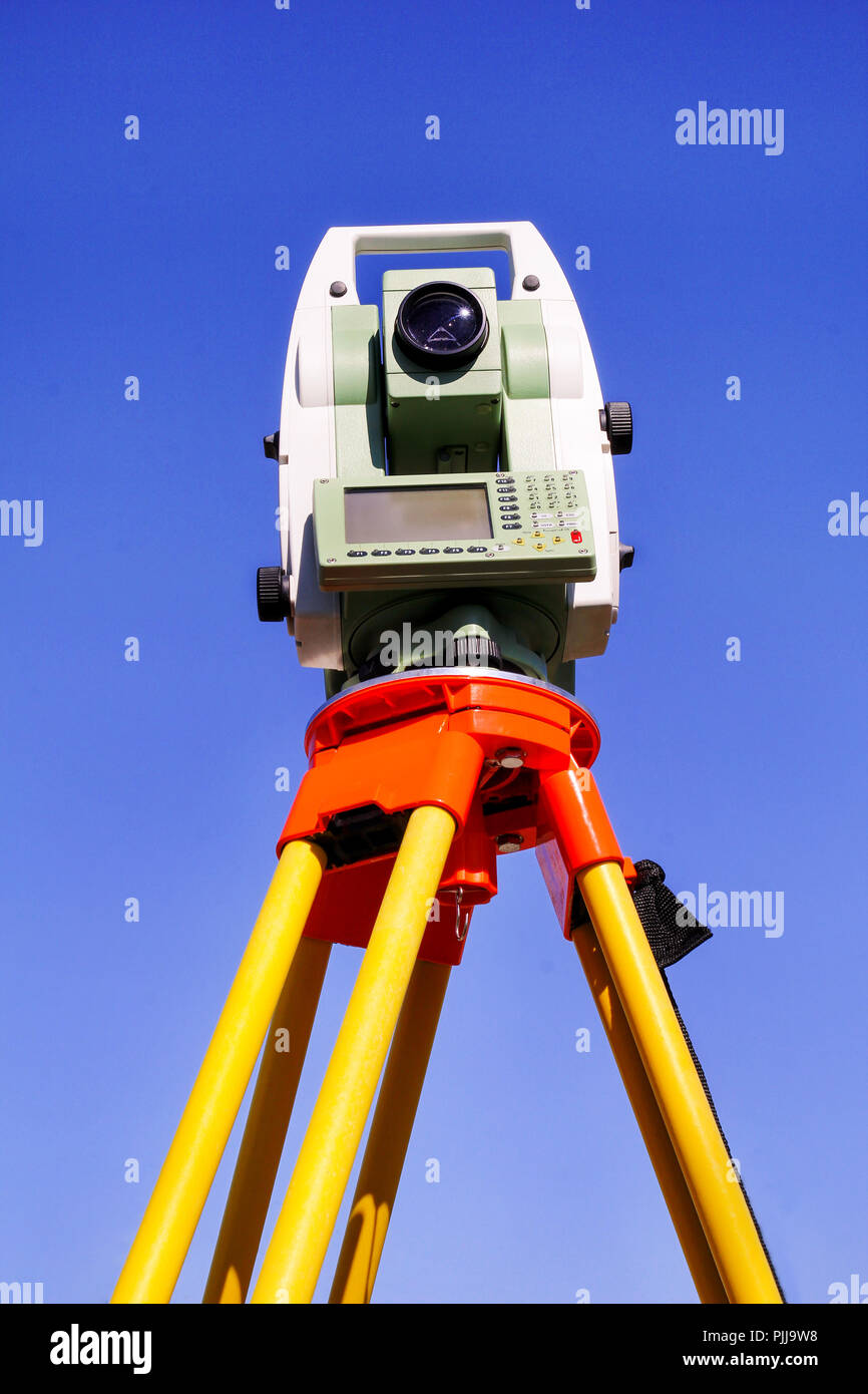 Total station with blue sky in the background. Survey Instrument ...
