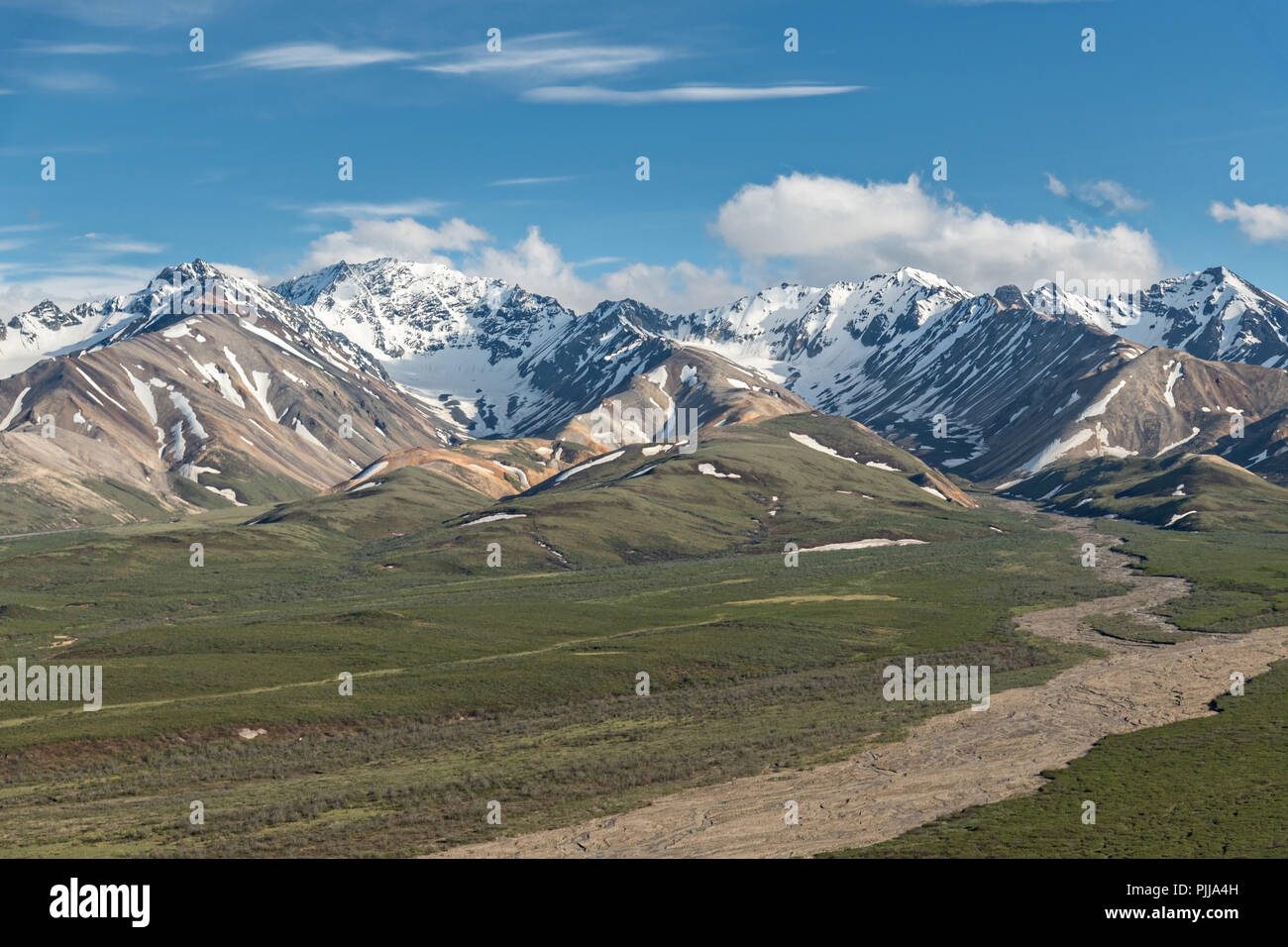 View of the Polychrome Hills and the Alaska Range and the Toklat River ...