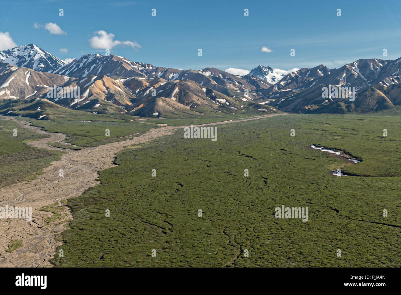 View of the Polychrome Hills and the Alaska Range and the Toklat River ...