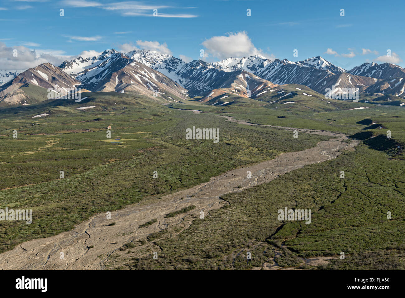 View of the Polychrome Hills and the Alaska Range and the Toklat River ...