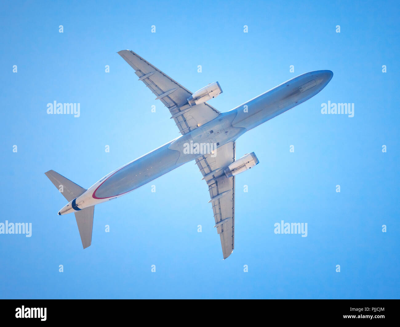 An image of a nice airplane in the blue sky Stock Photo - Alamy