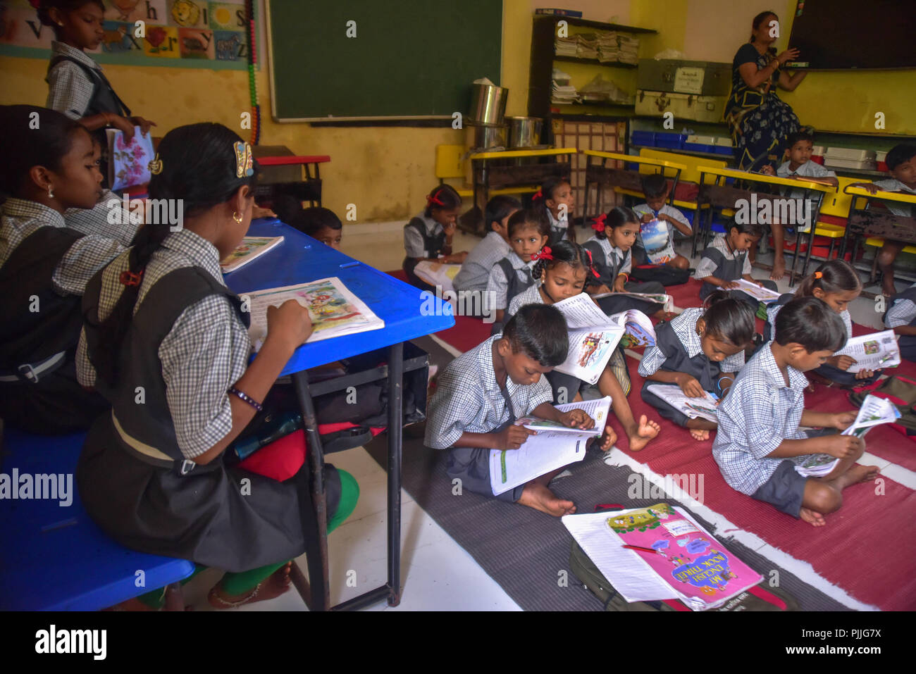 Thane, Maharastra, India. 7th Sep, 2018. Tribal Kids studying in their ...