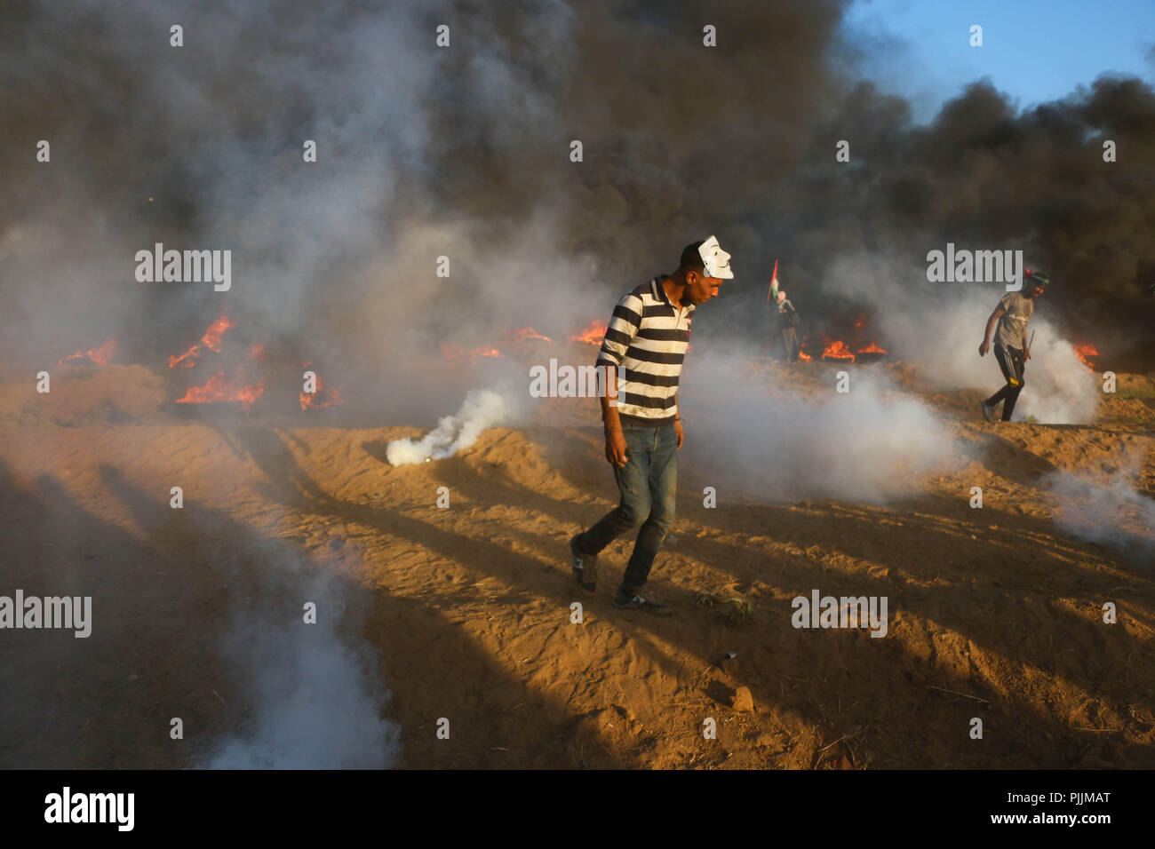 Man walking away from fire hi-res stock photography and images - Alamy
