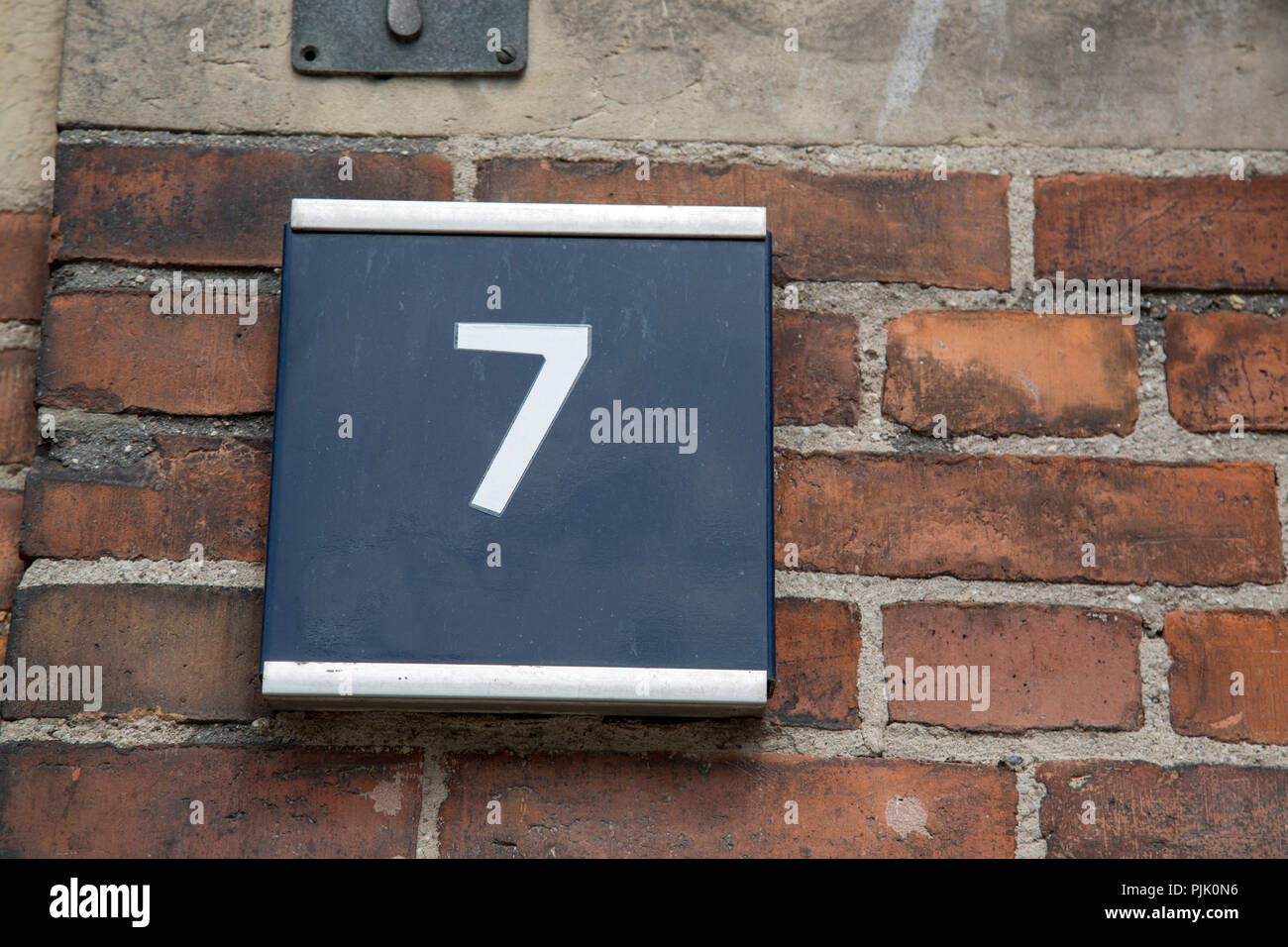 Number Seven on Brick Wall Stock Photo - Alamy