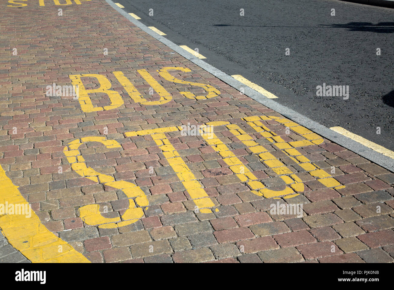 Bus Stop on Road Surface Stock Photo - Alamy