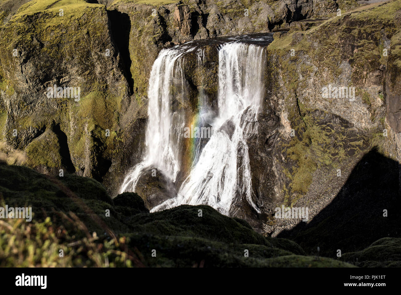 A mighty waterfall with rainbow in Iceland Stock Photo - Alamy