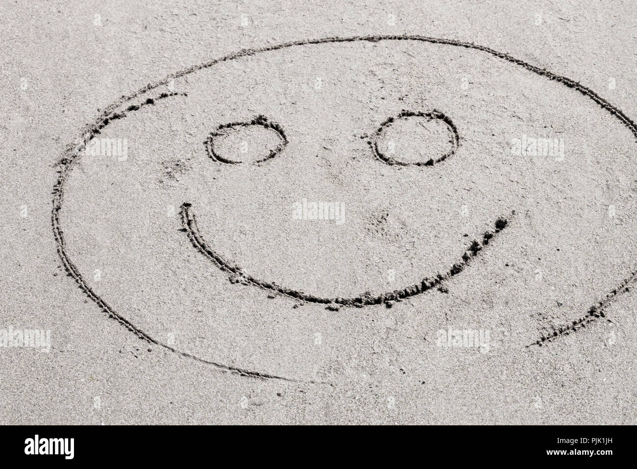 Smiley in the sand hi-res stock photography and images - Alamy