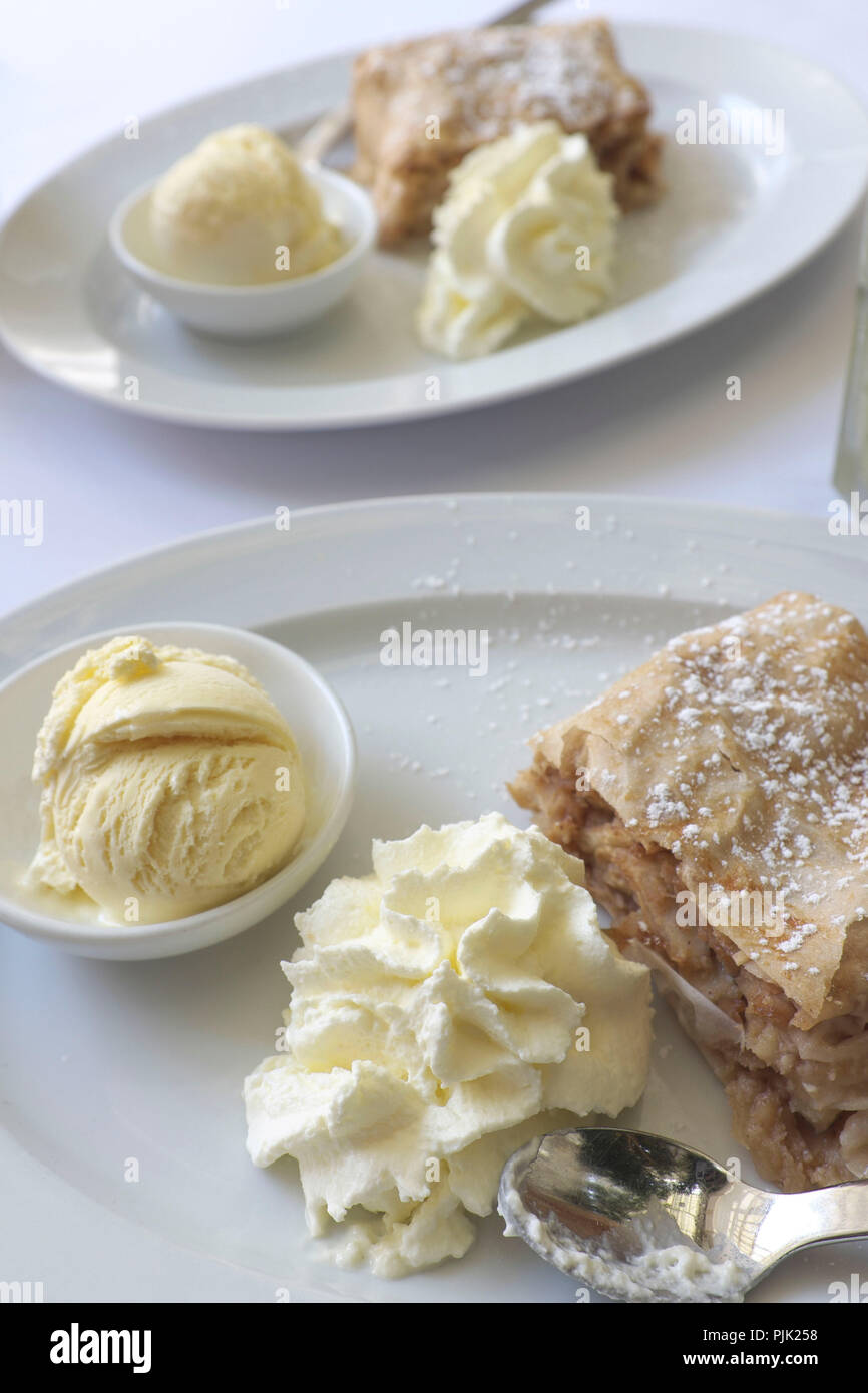 Apple strudel with ice cream and cream Stock Photo - Alamy