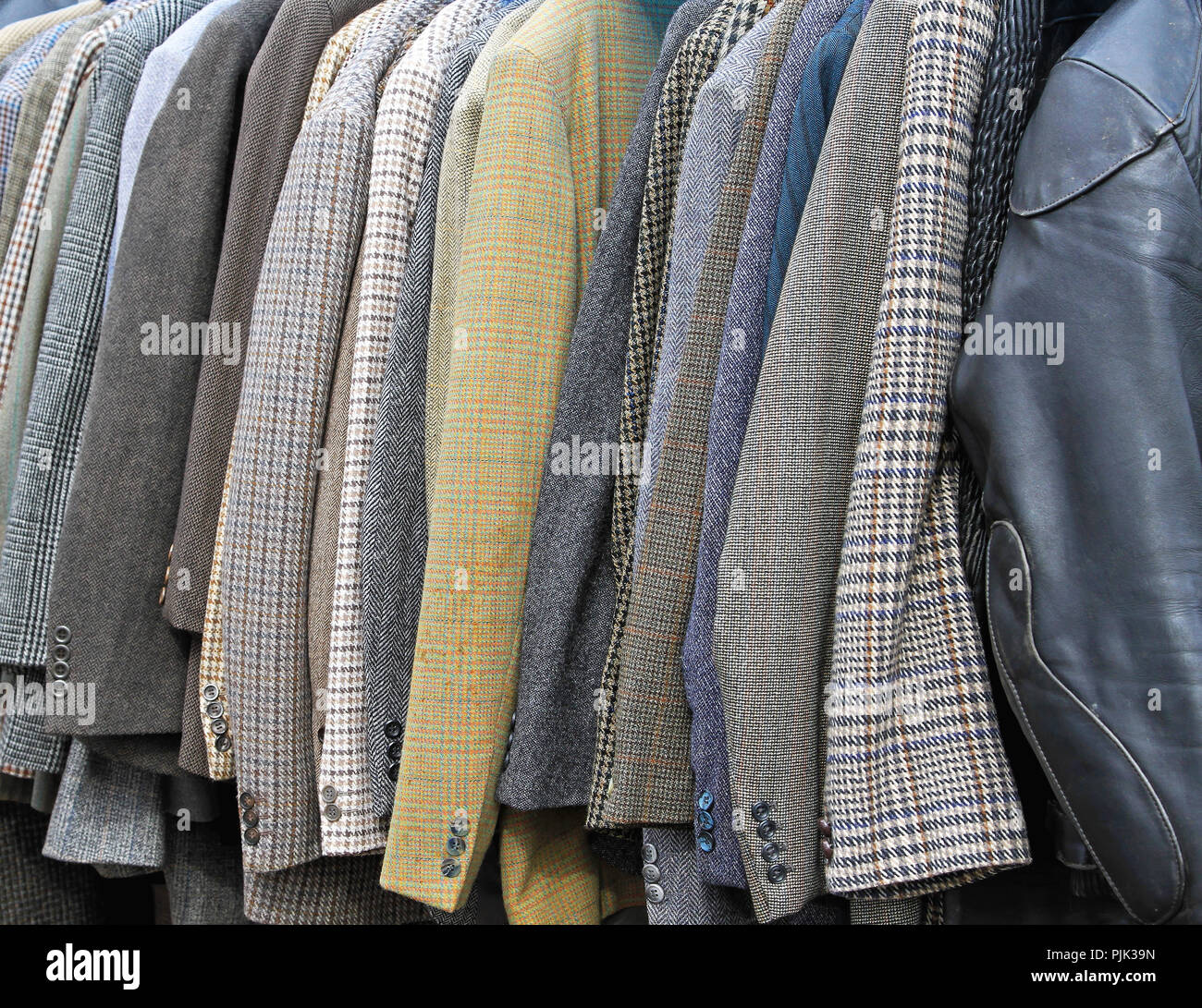 Old retro style suits and coats at rail Stock Photo - Alamy