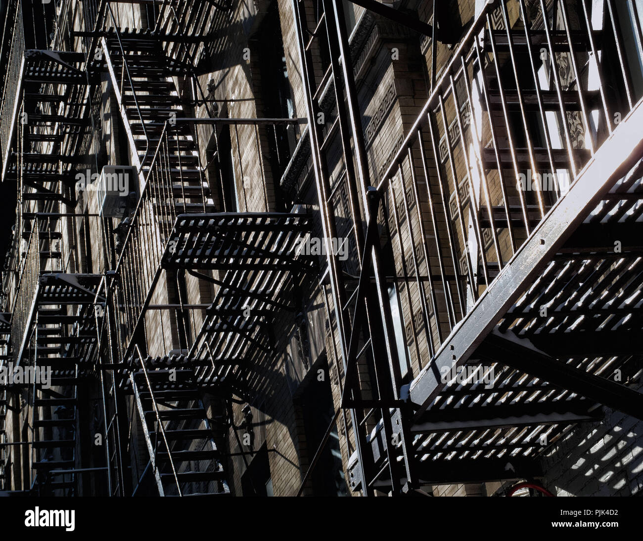 Fire exit stairs on typical New York brick buildings in Manhattan, New ...