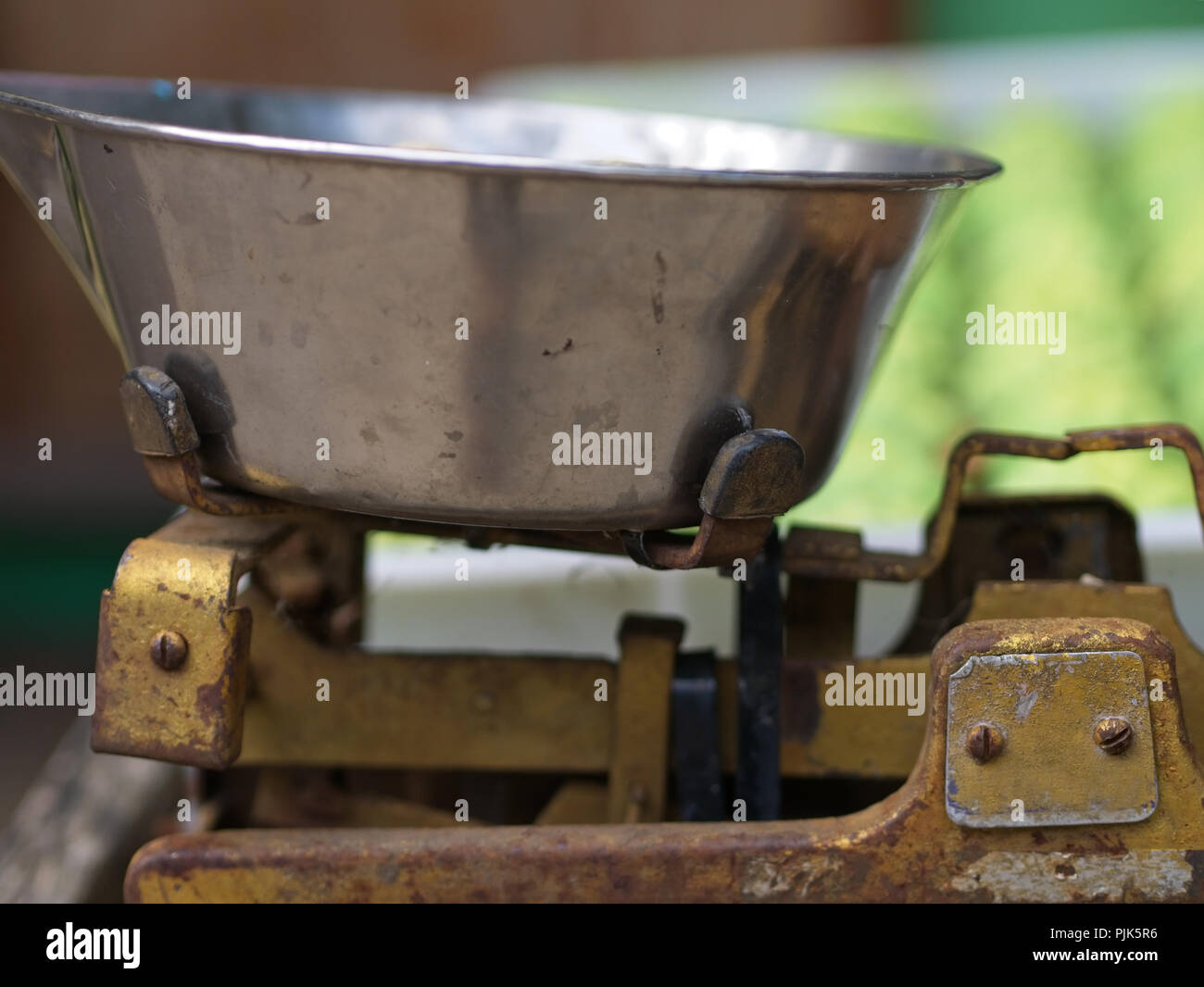 Close-up of traditional old balance weighing scale with big and deep ...