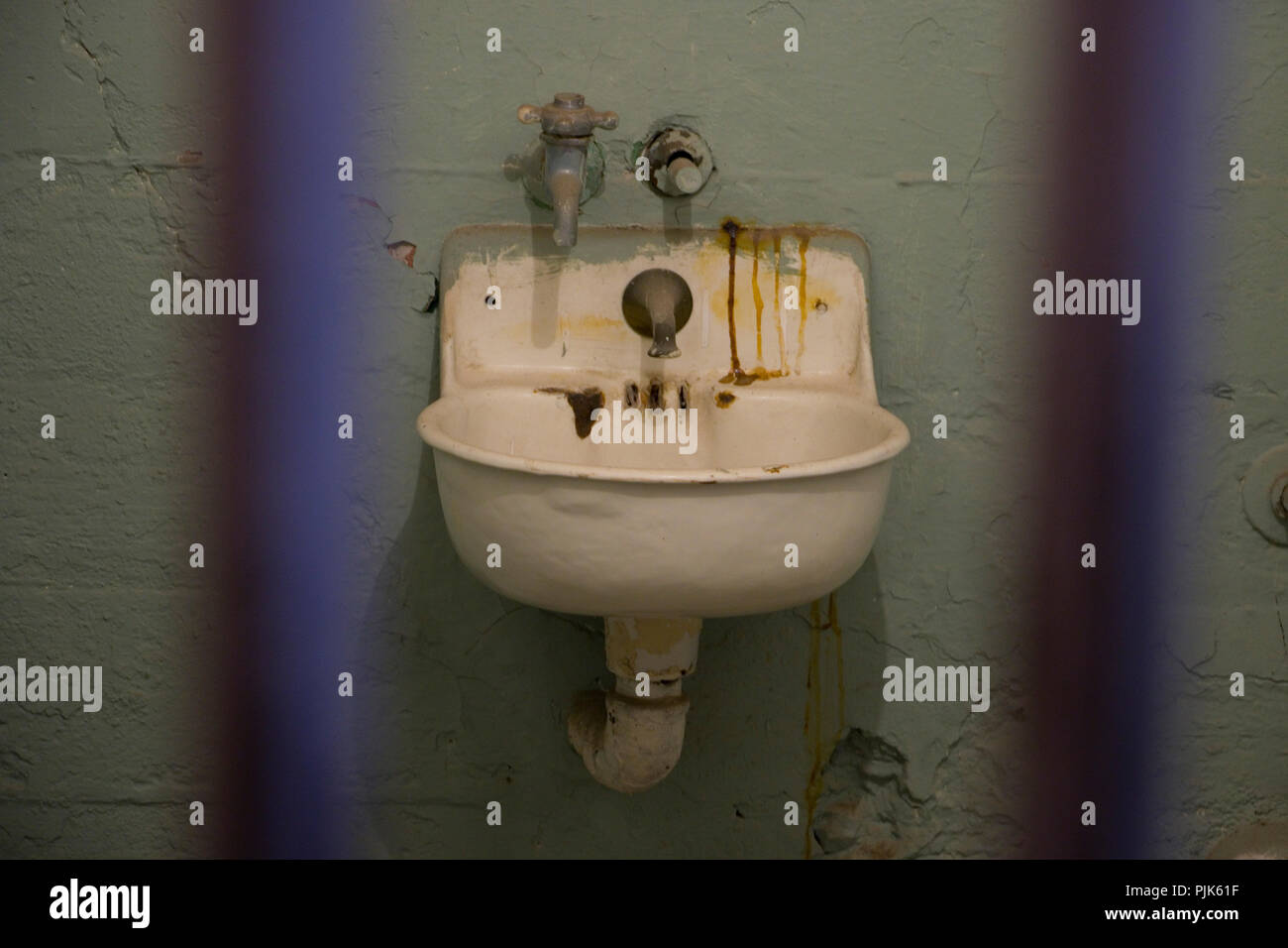 Jail sink in Alcatraz prison with bars in the foreground Stock Photo ...