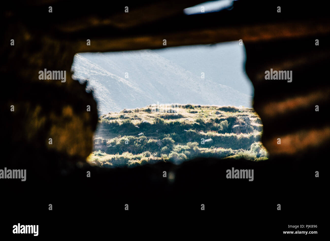 View of a mountain through an old window of an old hut Stock Photo - Alamy