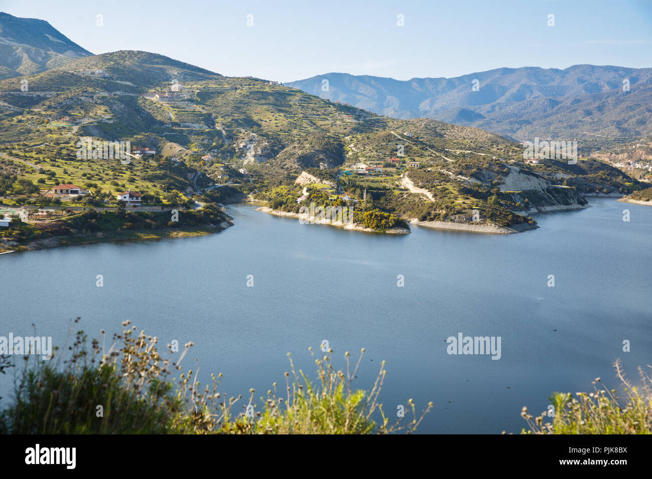Cyprus landscape with mountains, lake and village Stock Photo - Alamy