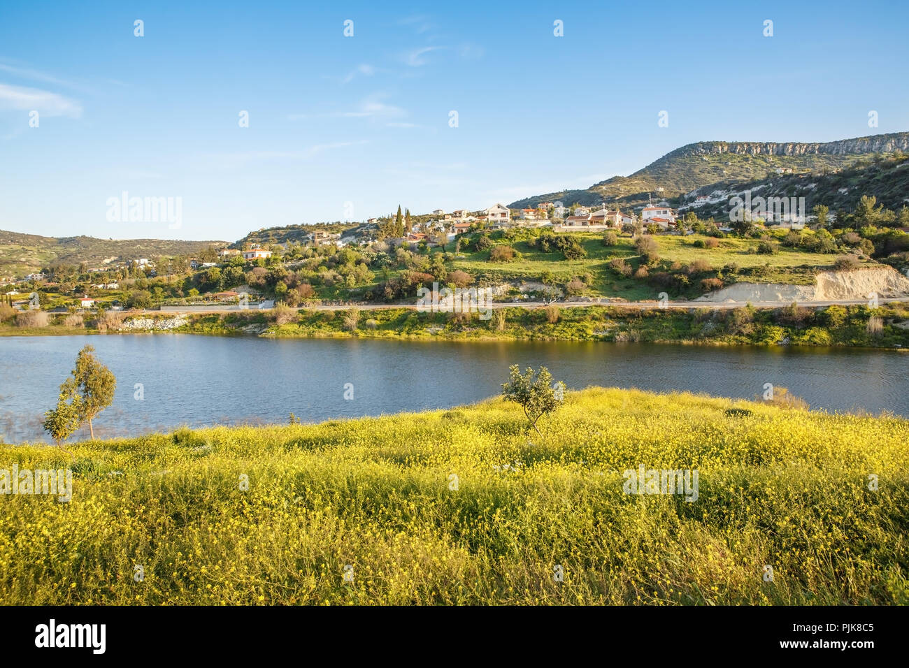 Cyprus landscape with mountains, lake and village Stock Photo - Alamy