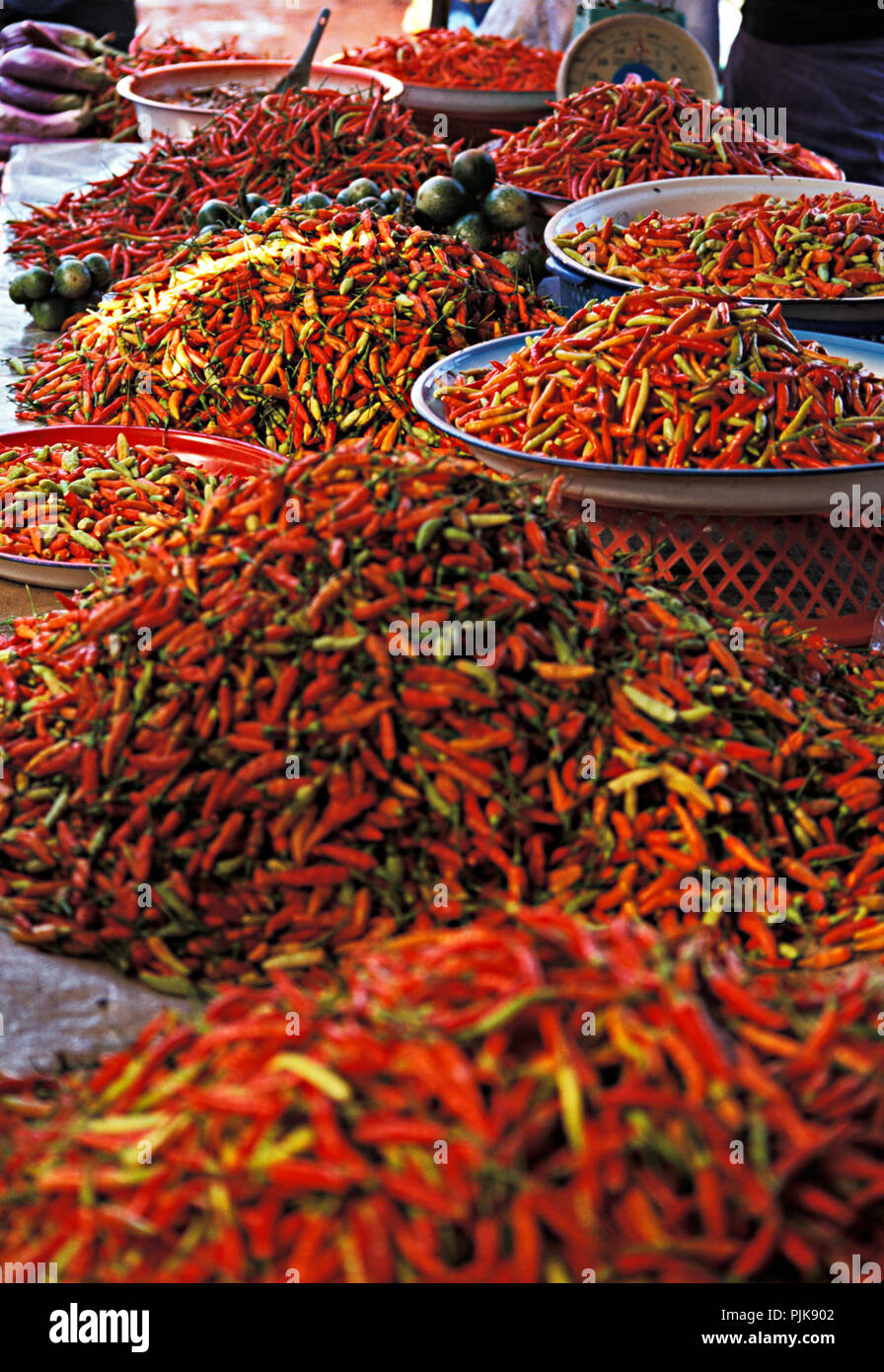Piles of chilli in a market stall in Laos Stock Photo - Alamy