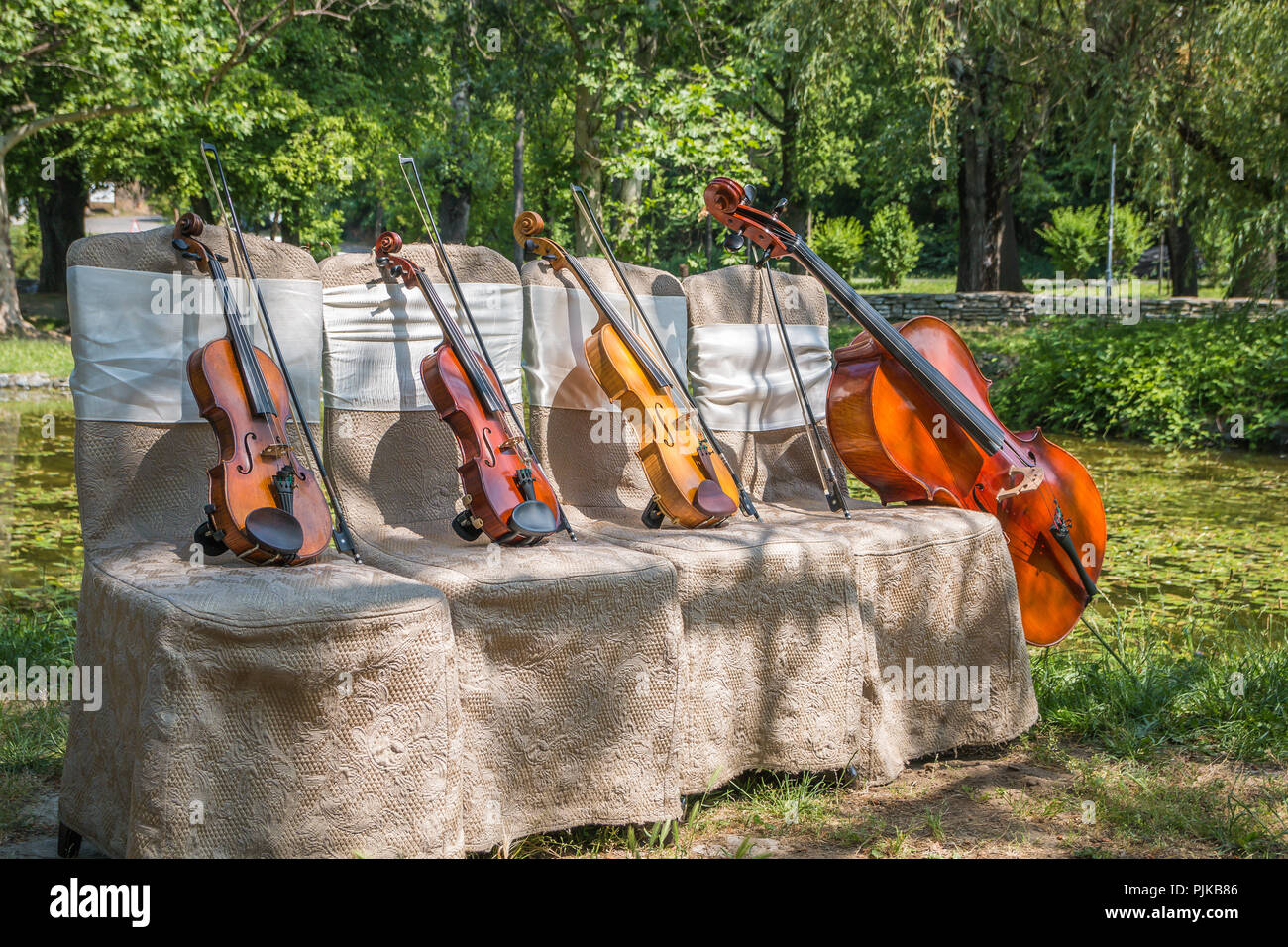 String quartet instruments on chairs hi-res stock photography and ...