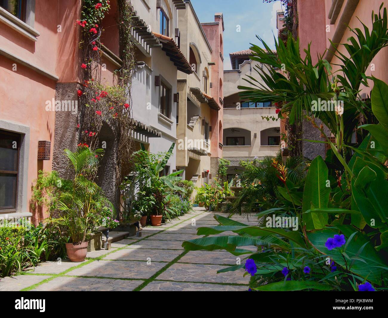 Colorful Buildings with Very Colorful and Lush Landscaping and Fountain ...