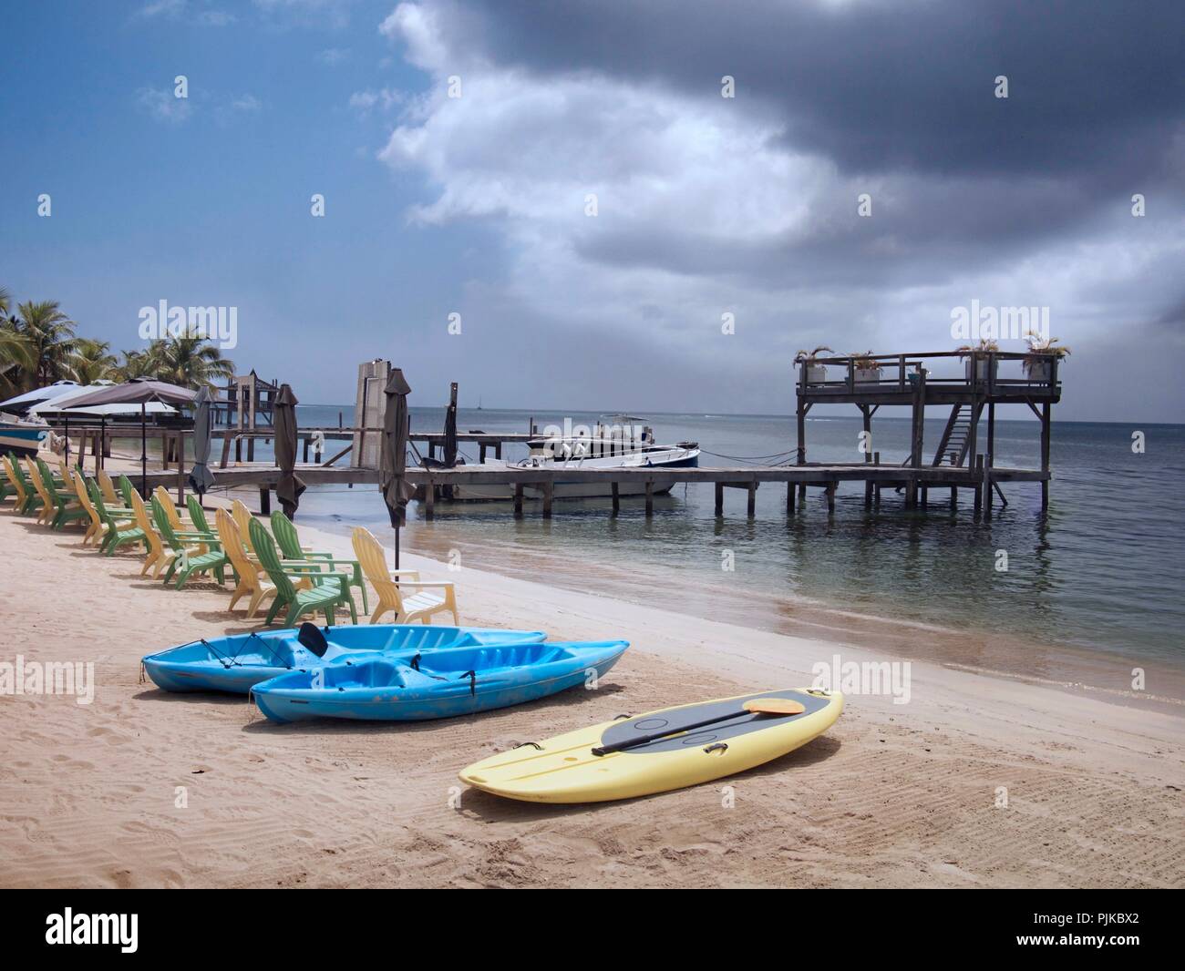 Beach with Kayaks and a Pier at West End, Roatan, Honduras Stock Photo ...