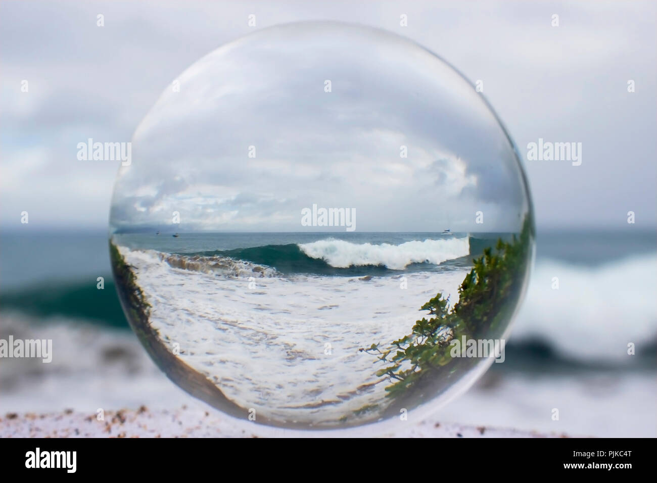 Breaking Wave Captured in Glass or Crystal Ball Stock Photo - Alamy